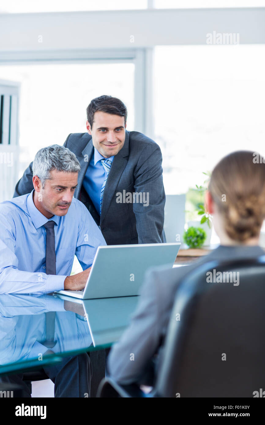 Business people speaking together during meeting Stock Photo - Alamy