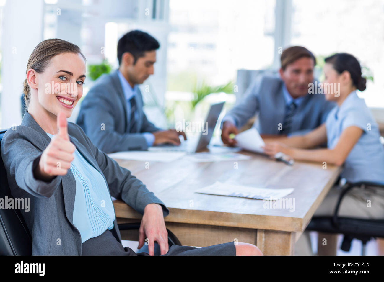 Business people speaking together during meeting Stock Photo - Alamy