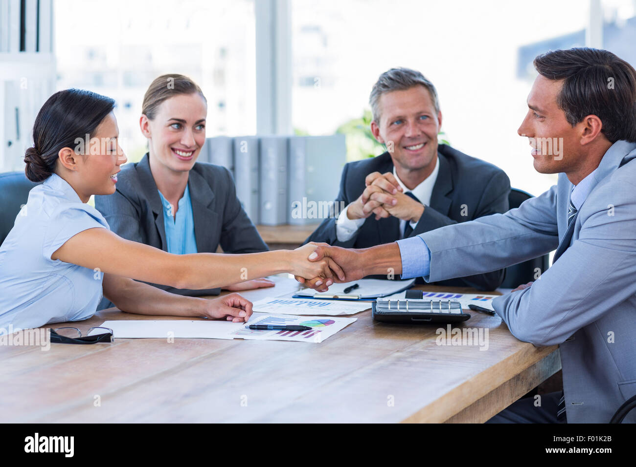 Business people shaking hands during meeting Stock Photo - Alamy
