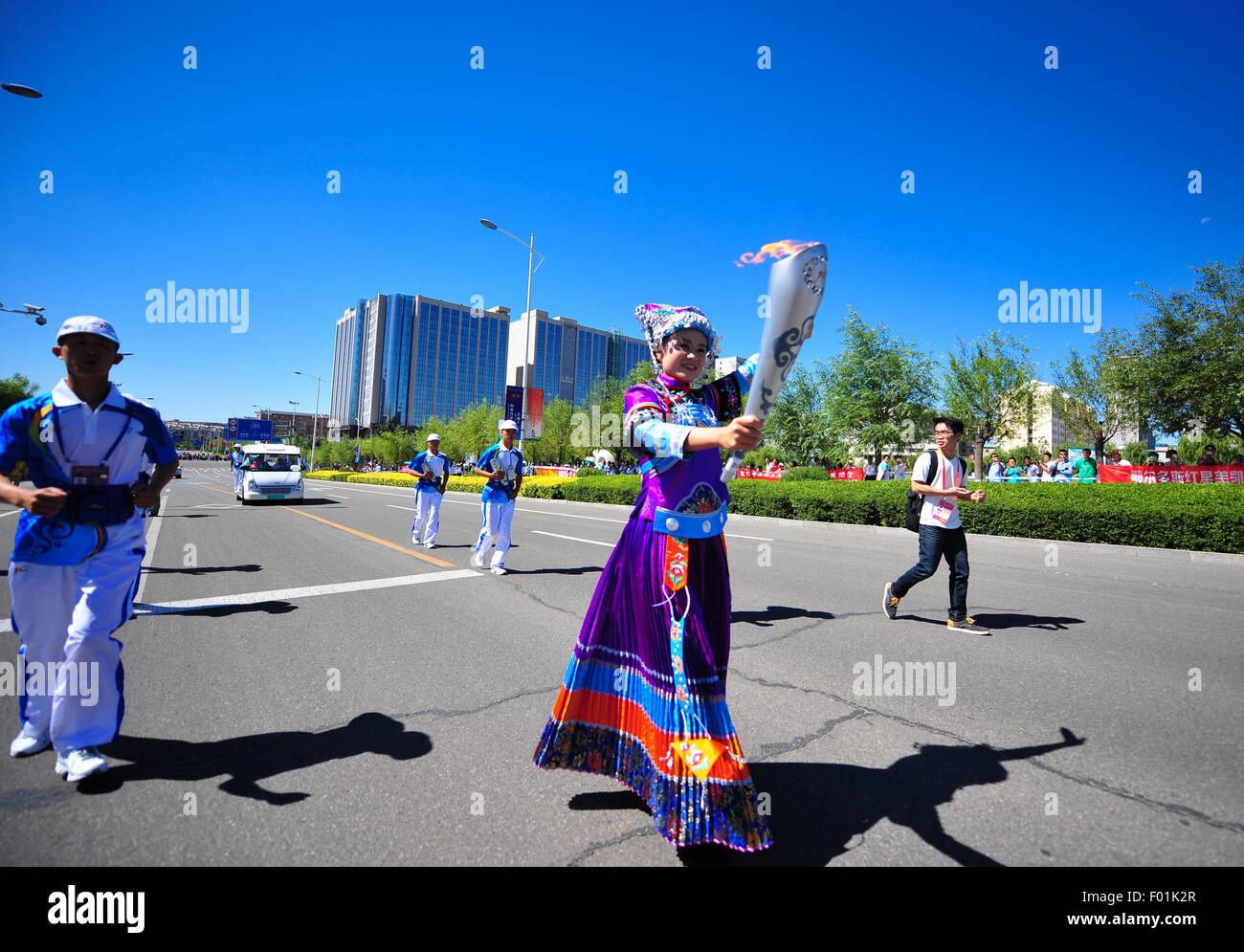 Erdos, Inner Mongolia Autonomous Region. 6th Aug, 2015. Torch bearer ...