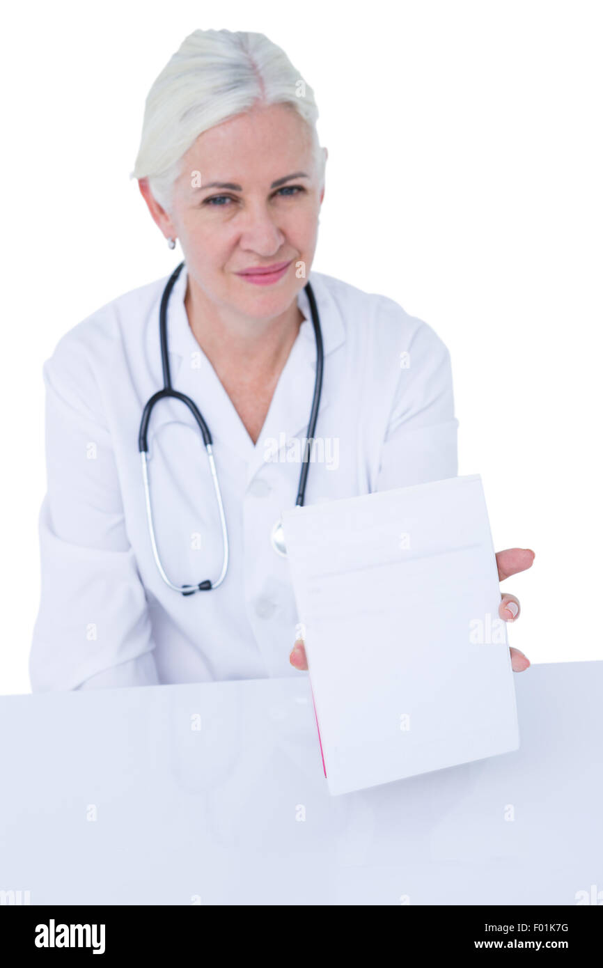 Doctor writing on a notepad Stock Photo - Alamy
