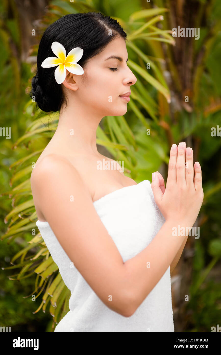 Pretty woman praying before her spa day Stock Photo - Alamy