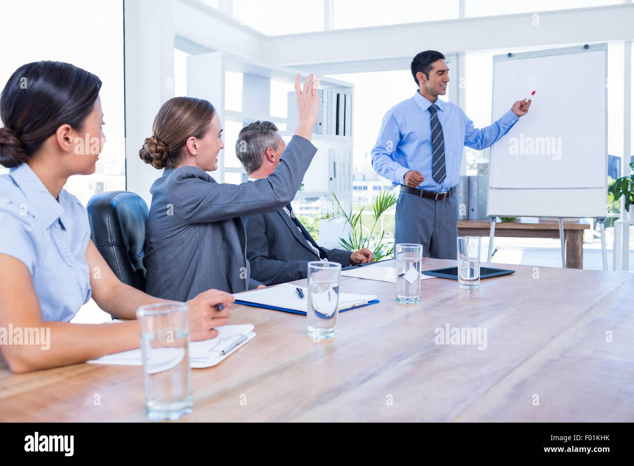 Young people talking during meeting hi-res stock photography and images ...