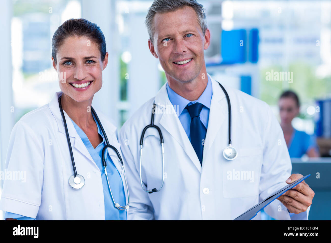 Happy doctors smiling at camera Stock Photo - Alamy
