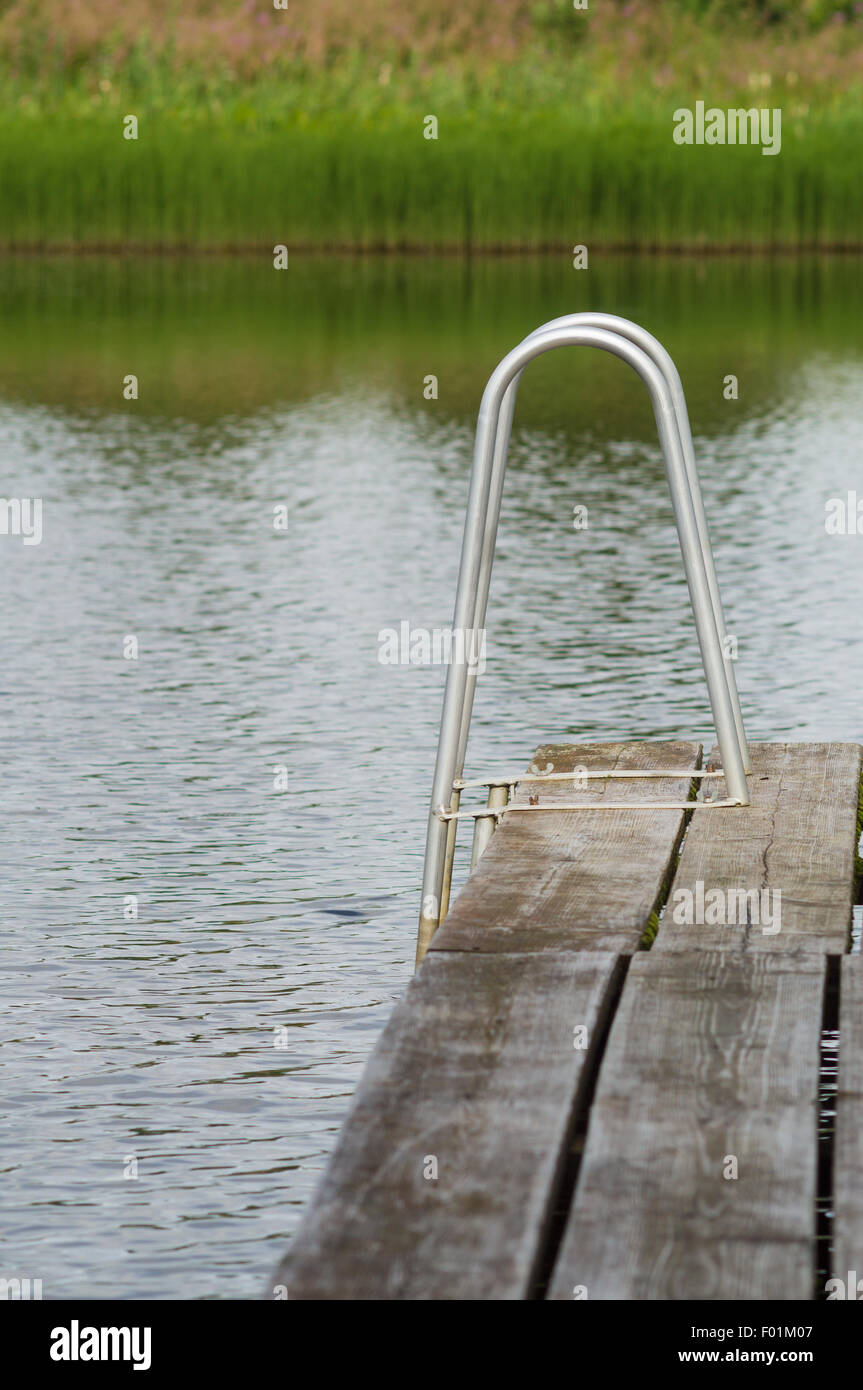 Jetty walkway pier with stairs to the lake Stock Photo - Alamy