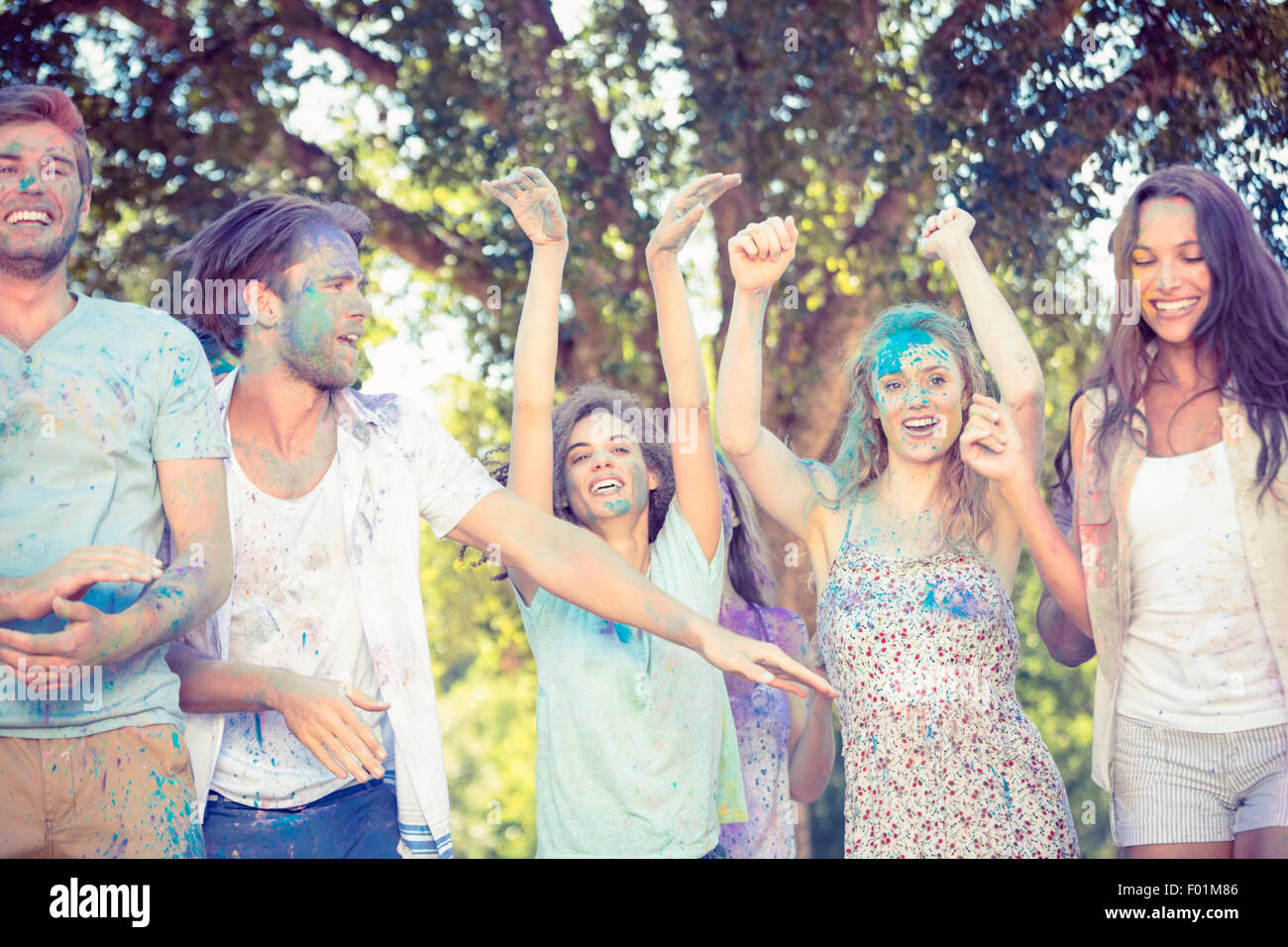 Friends having fun with powder paint Stock Photo - Alamy