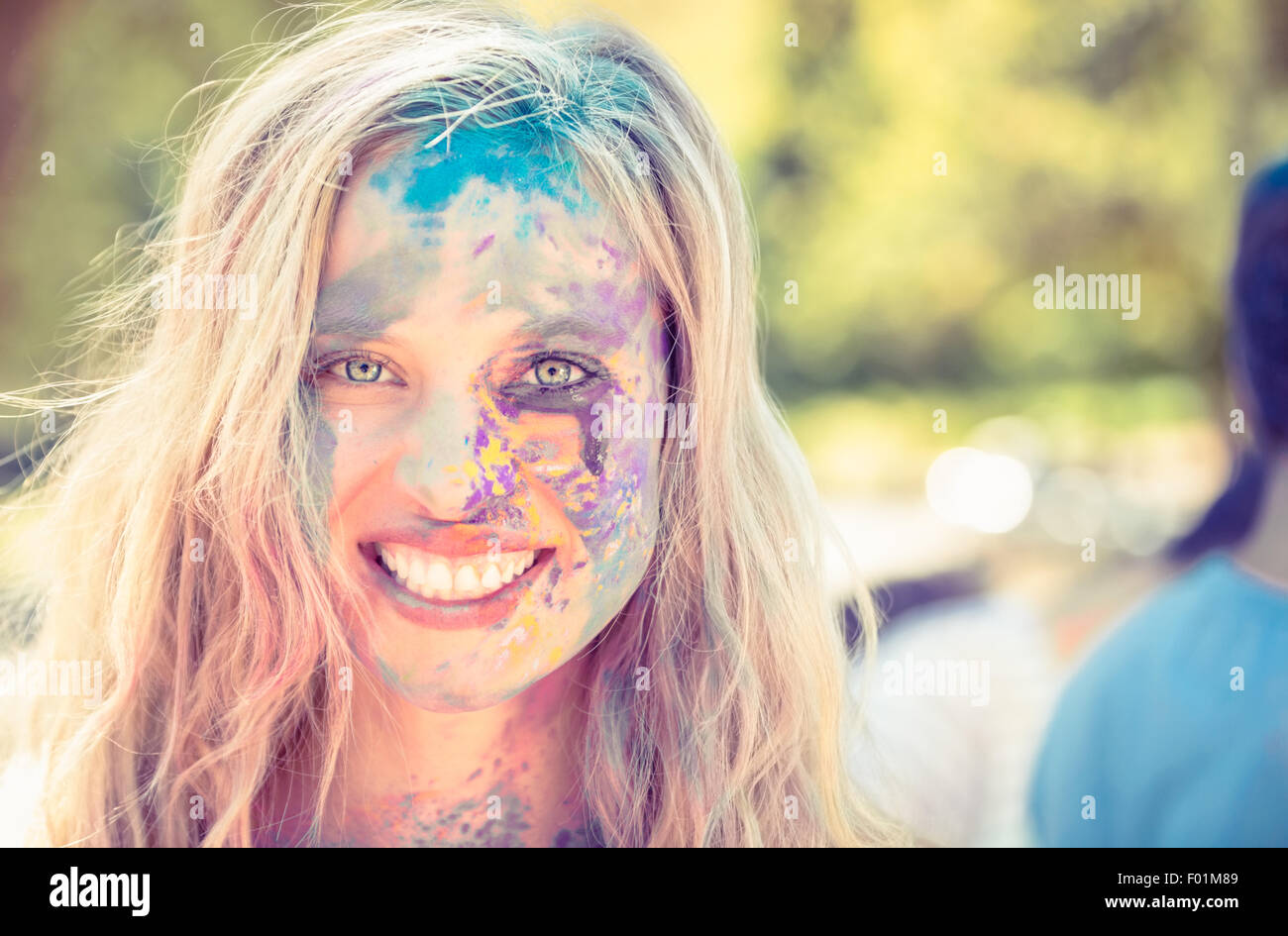 Young woman having fun with powder paint Stock Photo - Alamy
