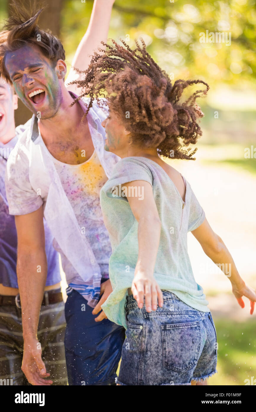 Young friends having fun with powder paint Stock Photo - Alamy