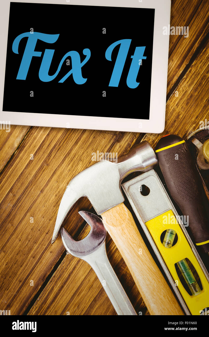 Fix it against desk with tools Stock Photo - Alamy
