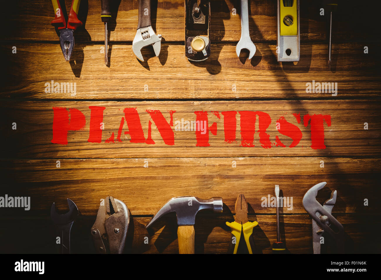 Plan first against desk with tools Stock Photo - Alamy
