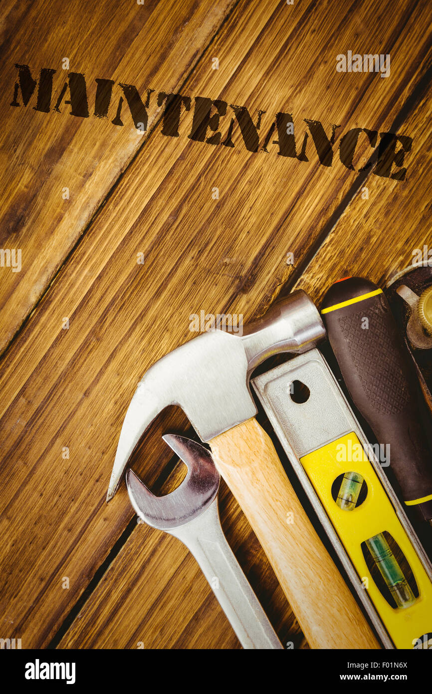 Maintenance against desk with tools Stock Photo - Alamy