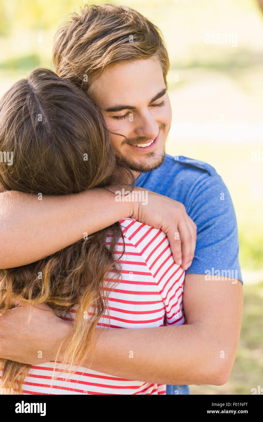 Cute couple hugging in the park Stock Photo - Alamy
