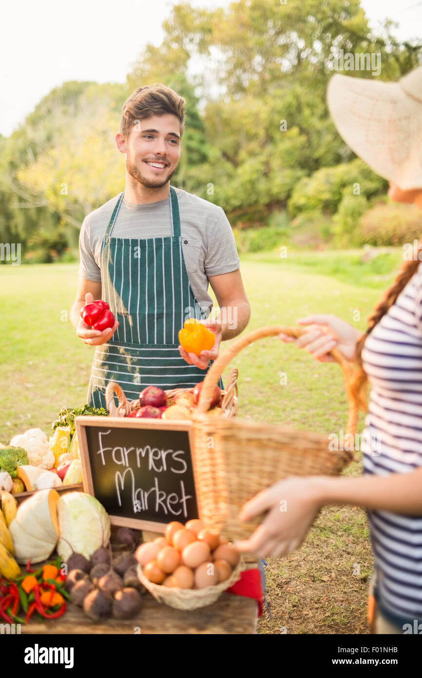 Happy farmers standing at their stall Stock Photo - Alamy