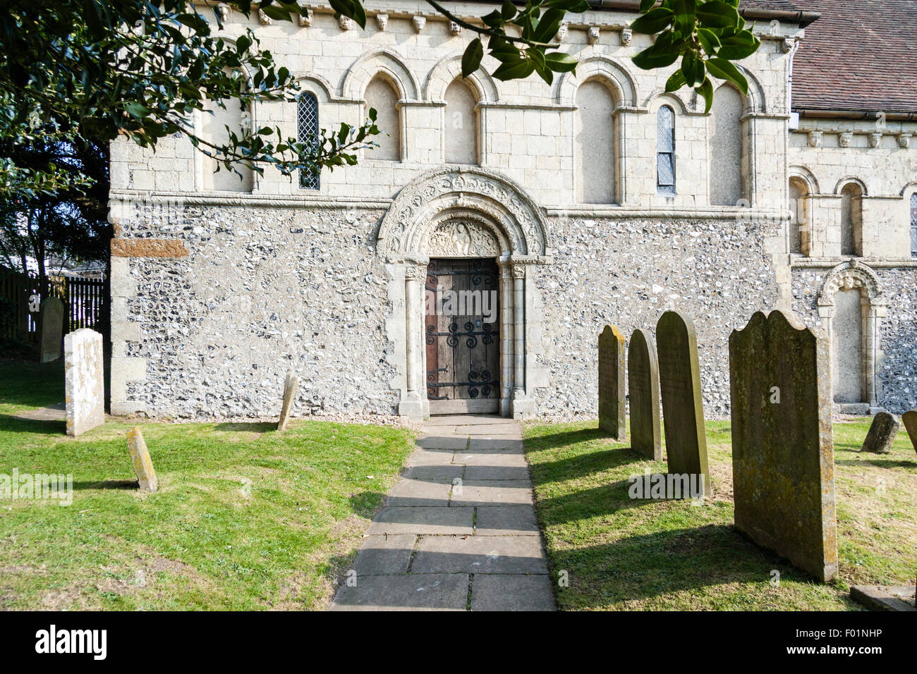 England, Barfrestone. Norman church stone carvings. Tympanum with stone ...