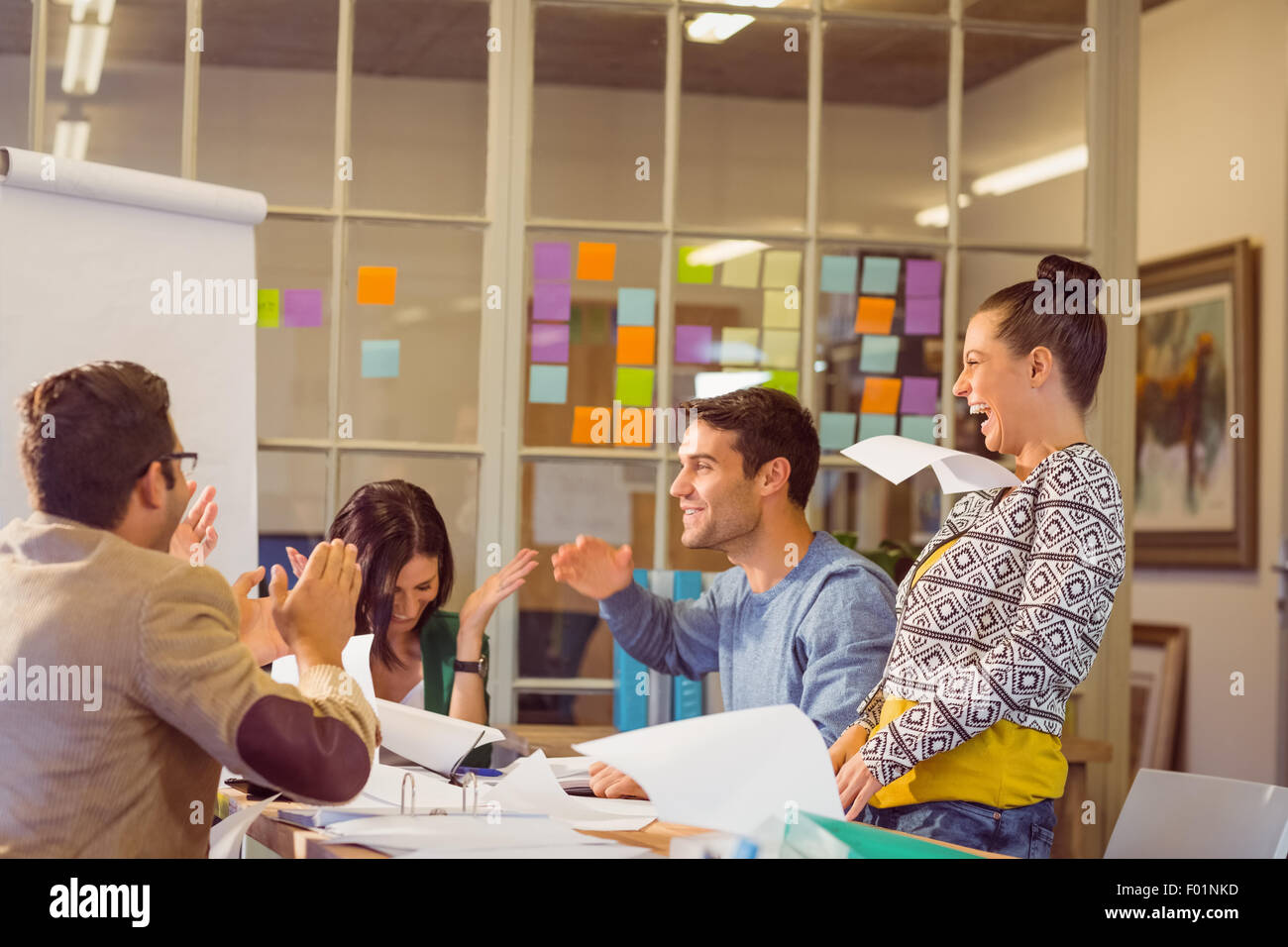 Celebrating business people throwing papers in the air Stock Photo - Alamy