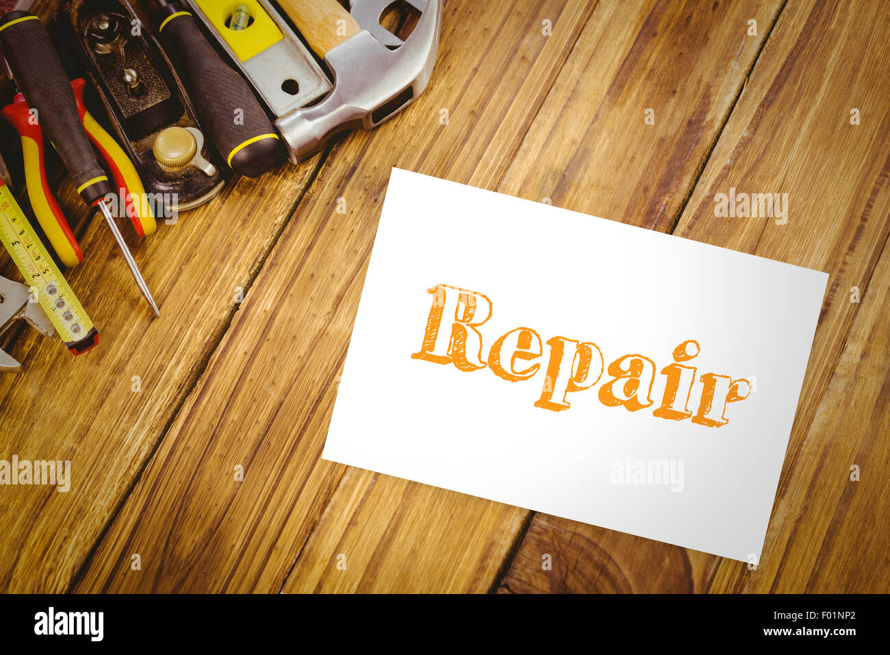Repair against desk with tools Stock Photo - Alamy