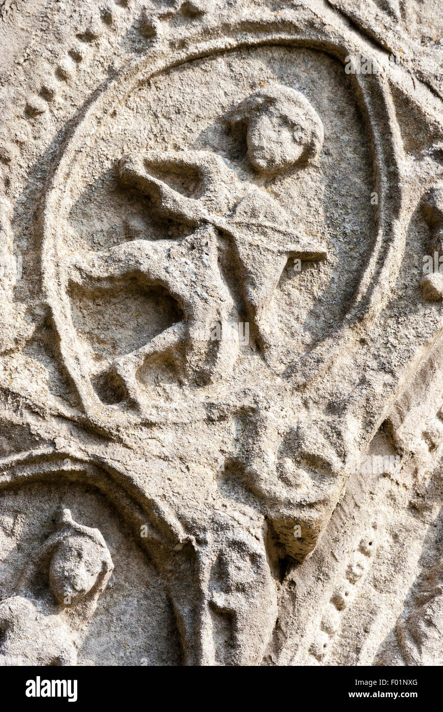 England, Barfrestone. Norman stone carvings. South Door tympanum, scene ...