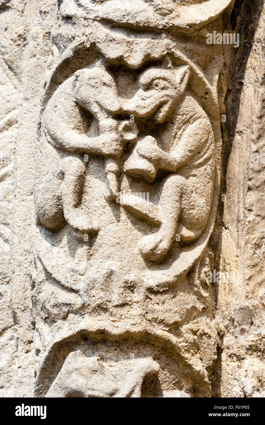 England, Barfrestone. Norman stone carvings. South Door. Scenes from ...