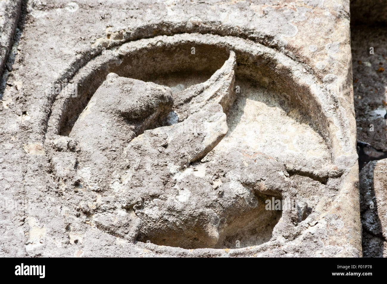 England, Barfrestone church, Norman stone carving. Close up of carved ...
