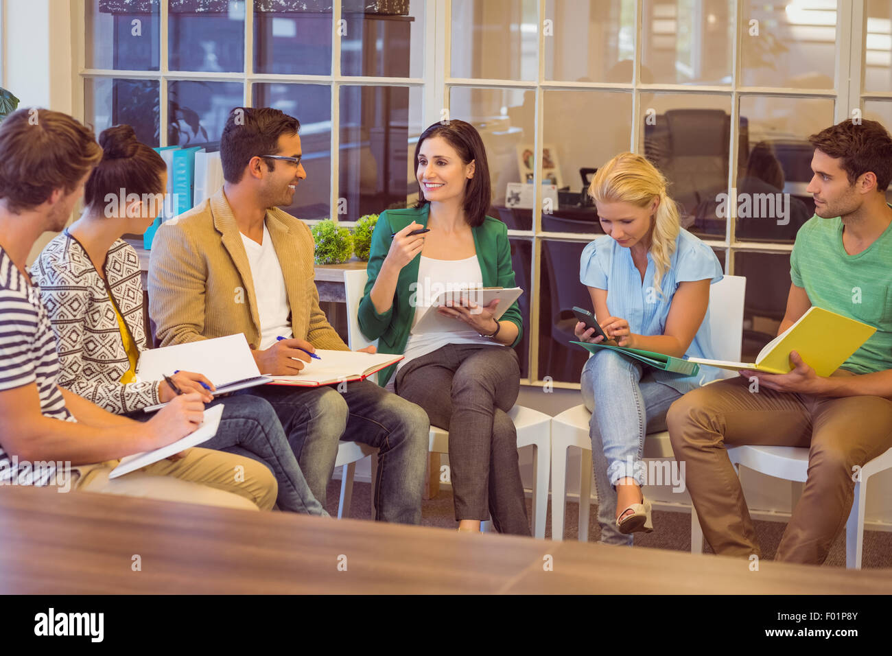 Attentive creative business people in meeting Stock Photo - Alamy