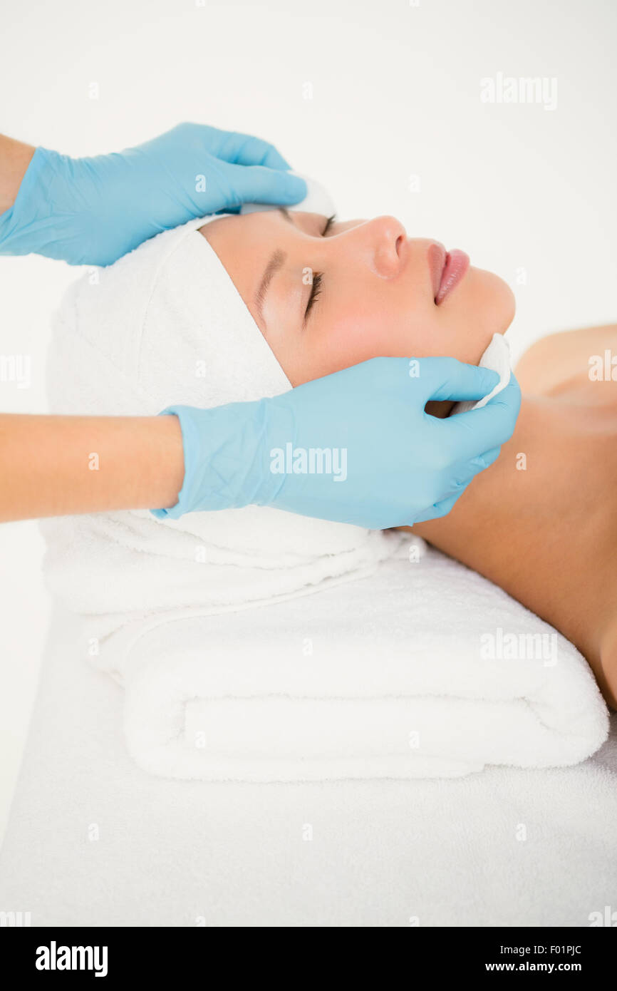 Hands cleaning woman face with cotton swabs Stock Photo - Alamy