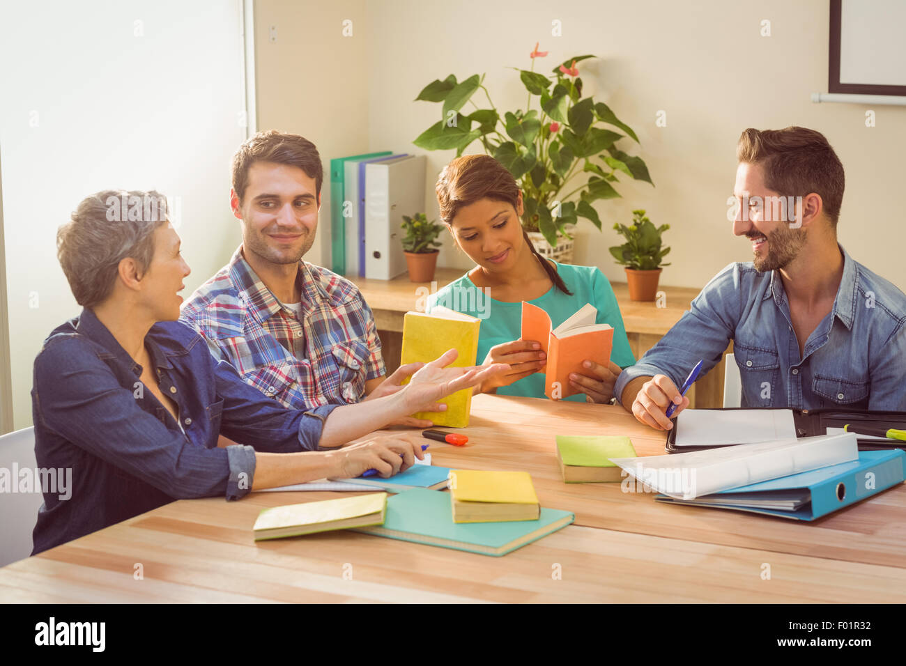 Group of colleagues reading books Stock Photo - Alamy