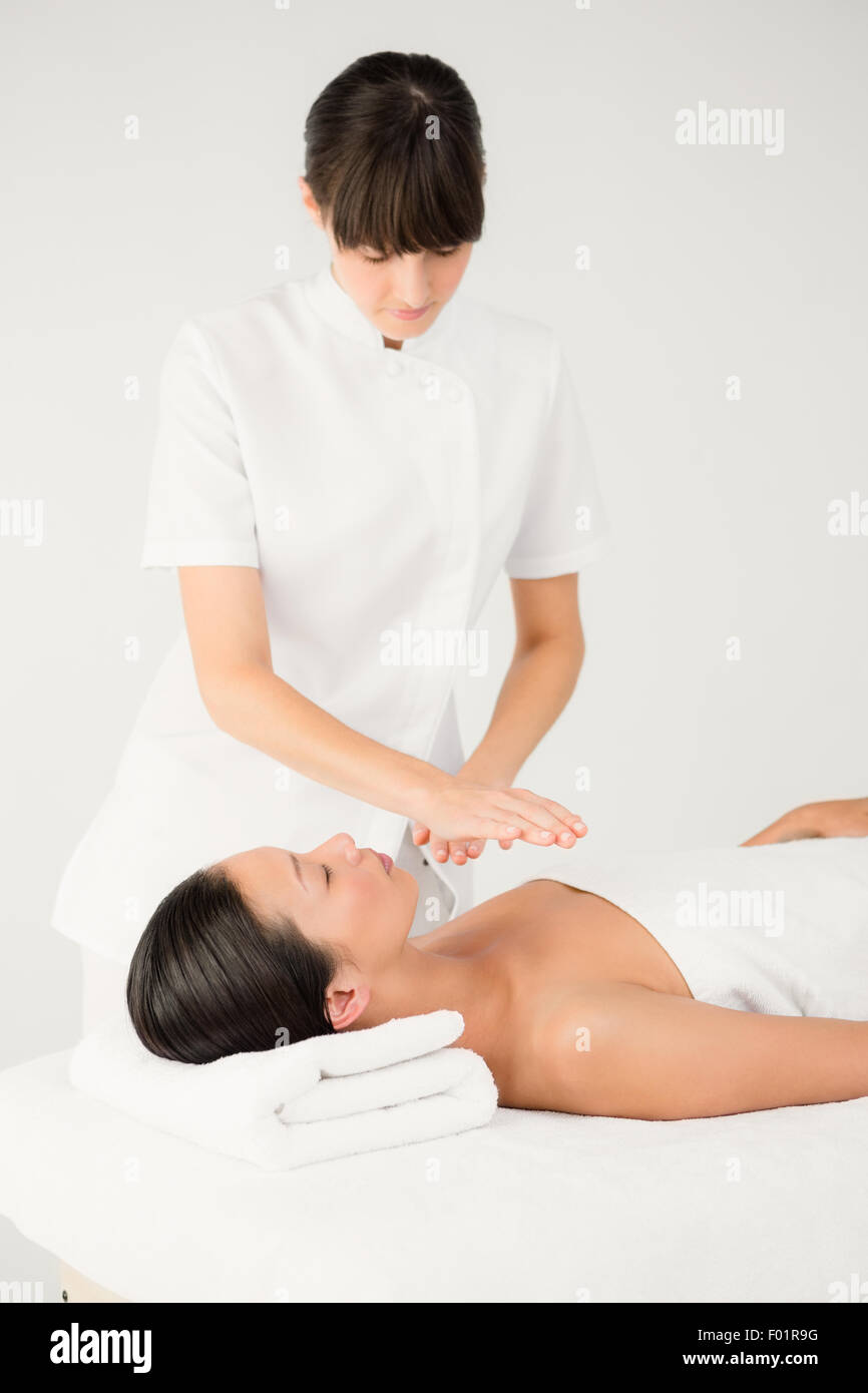 Woman receiving an alternative therapy Stock Photo - Alamy