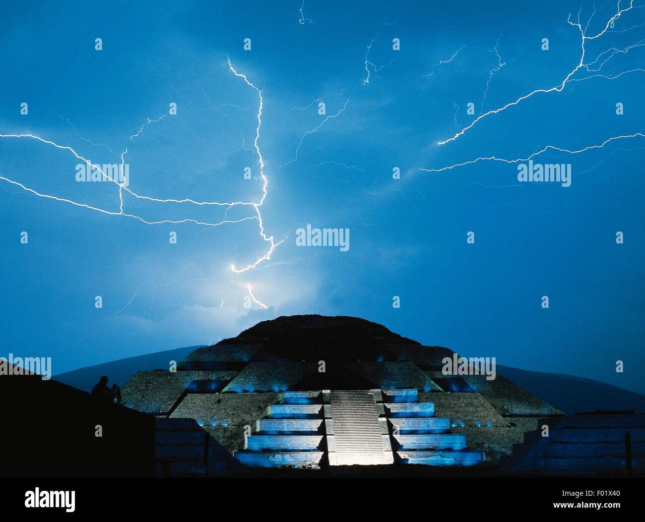 Lightning at night over a step pyramid Stock Photo - Alamy
