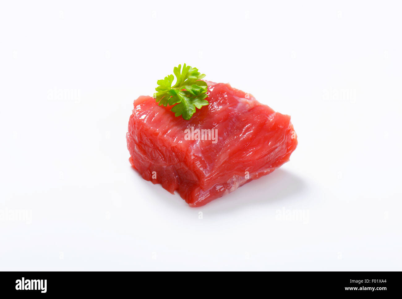 Chunk of raw beef steak on white background Stock Photo - Alamy