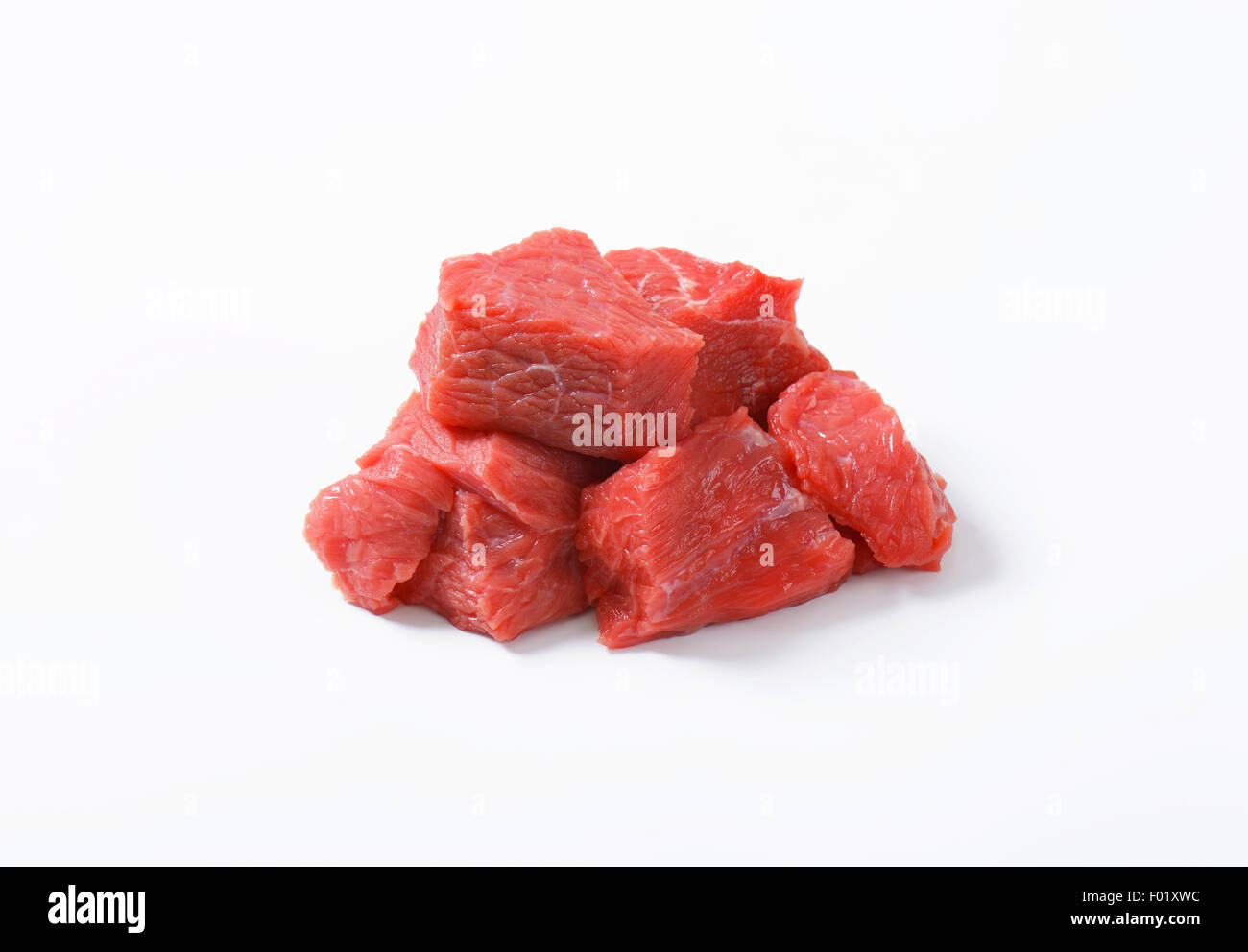 Raw beef cut into cubes Stock Photo - Alamy