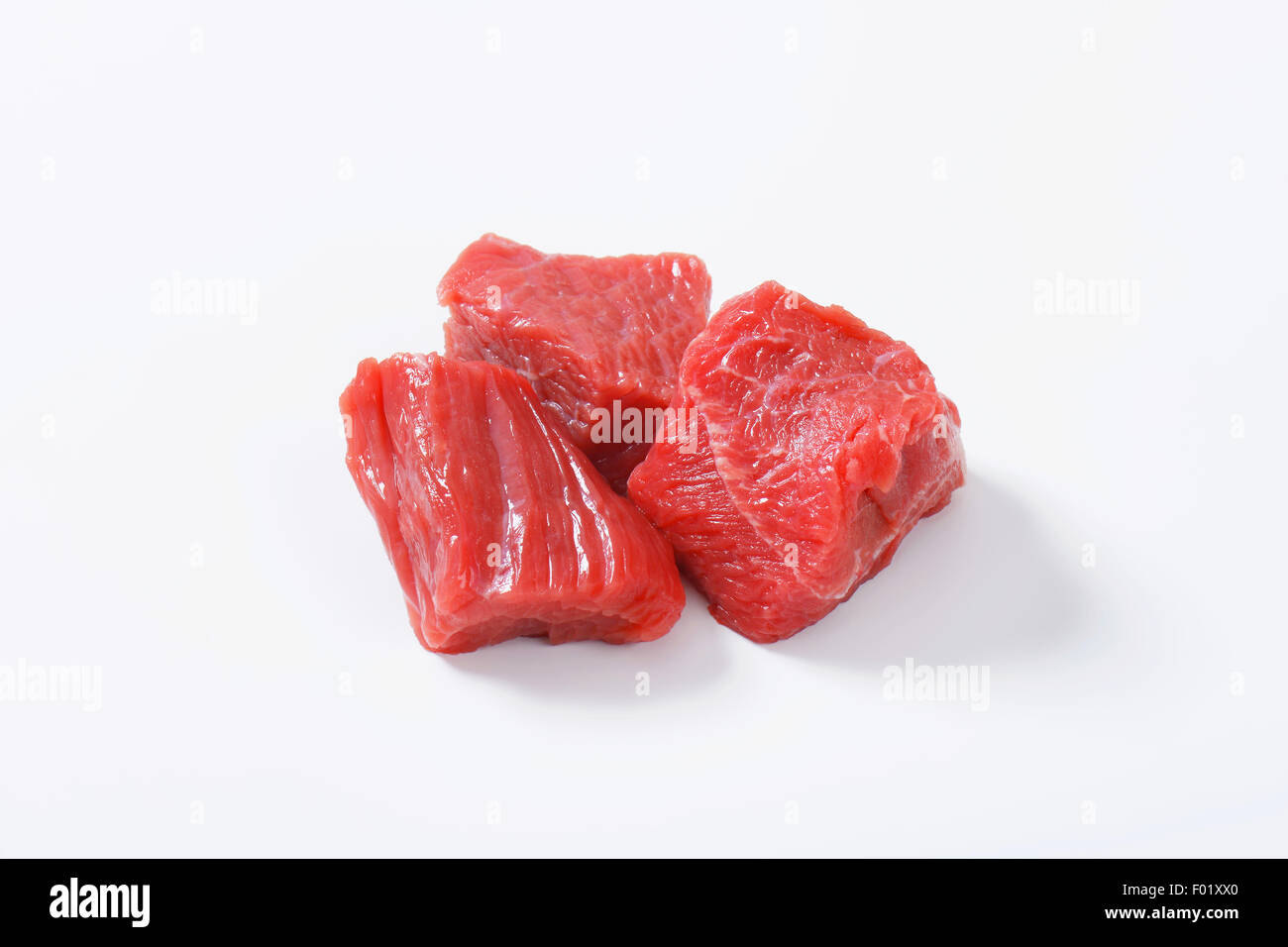Raw beef cut into cubes Stock Photo - Alamy