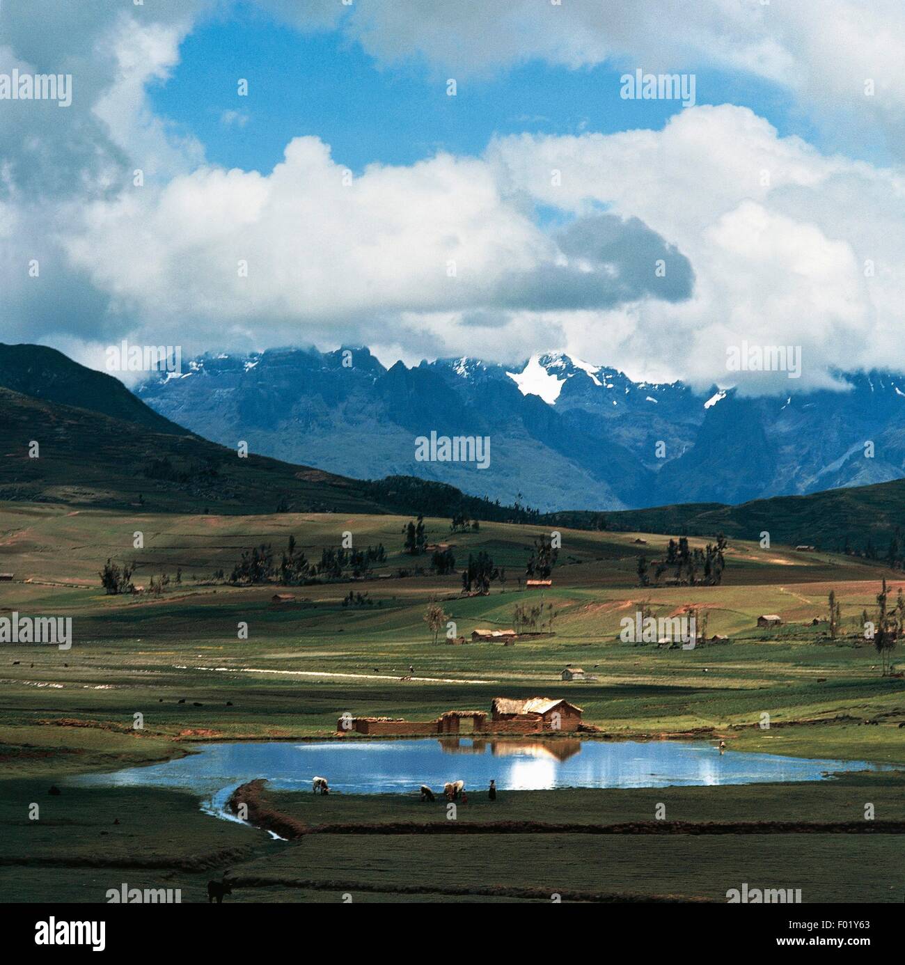 Landscape with traditional houses and a pond, near Chinchero, Andes ...