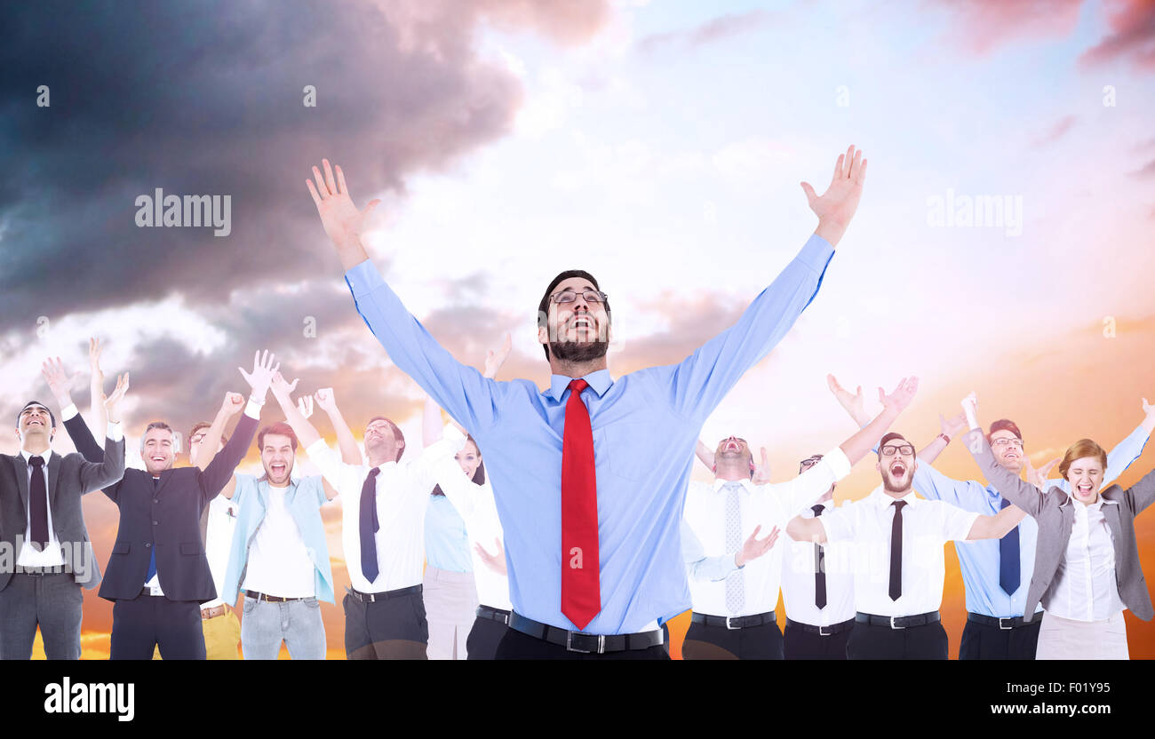 Composite image of happy cheering businessman raising his arms Stock ...
