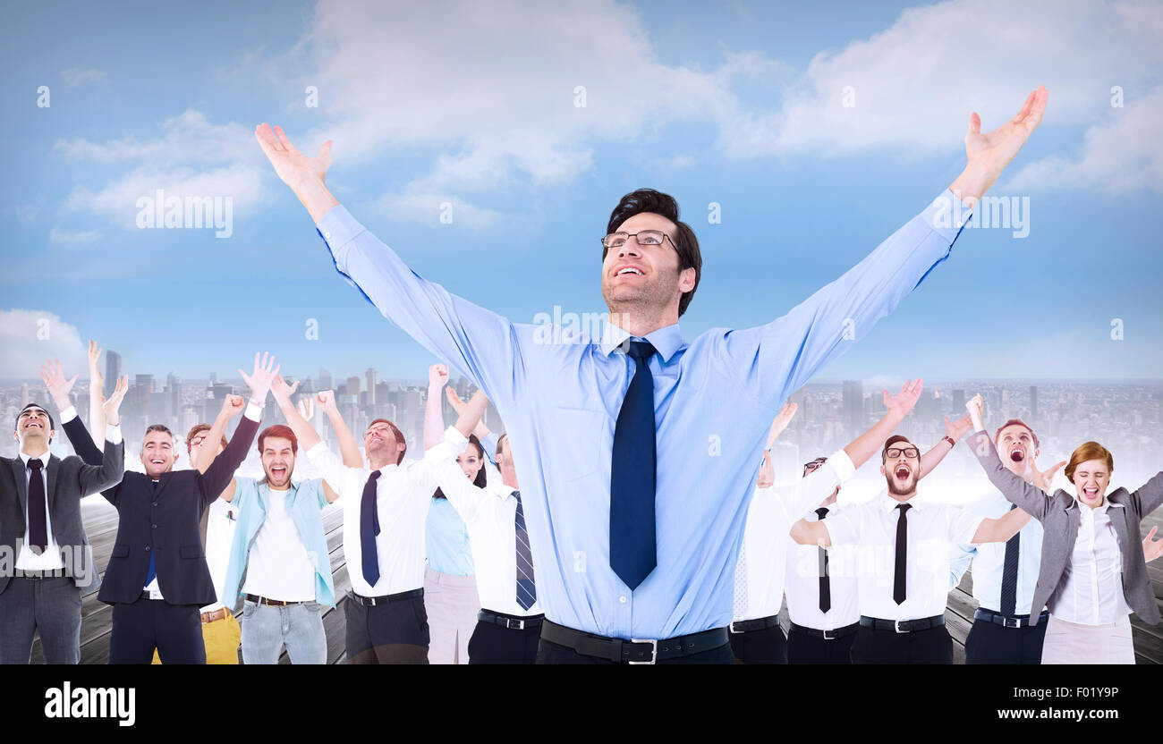 Composite image of cheering businessman with his arms raised up Stock ...