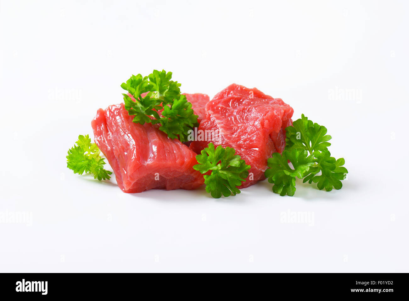 Raw beef cut into cubes Stock Photo - Alamy