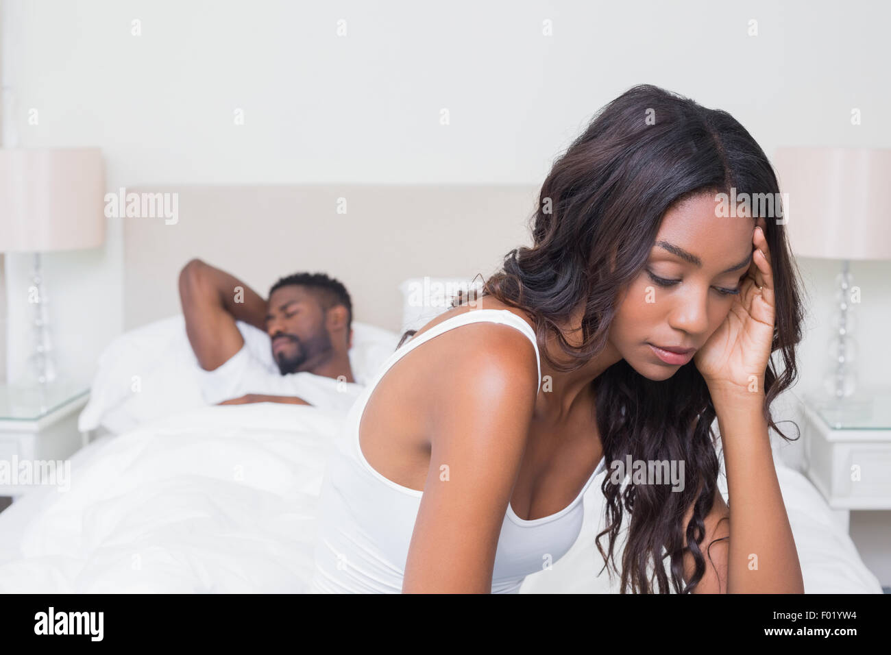 Woman sitting on the bed edge hi-res stock photography and images - Alamy