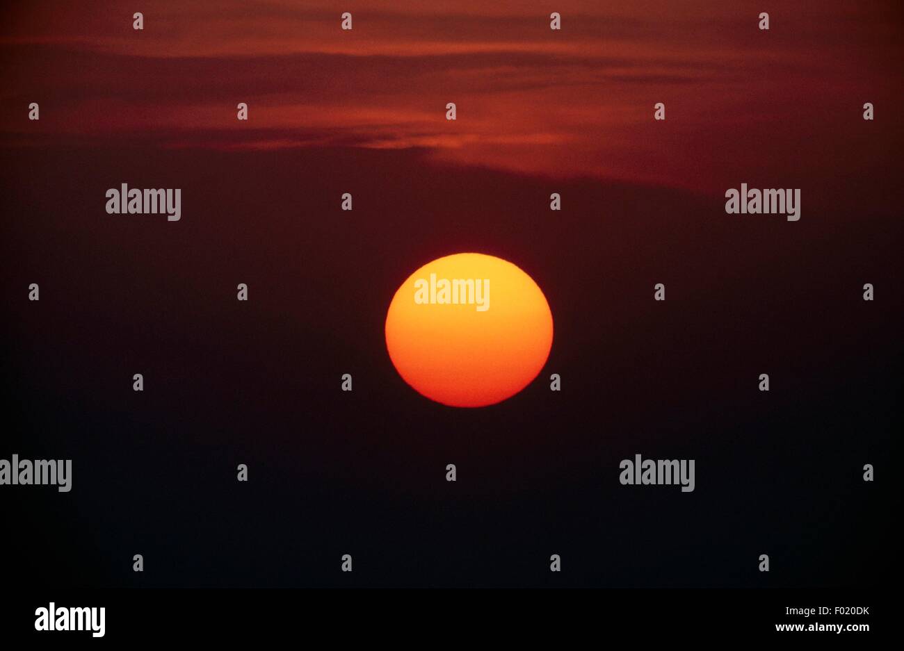 The setting sun Stock Photo - Alamy
