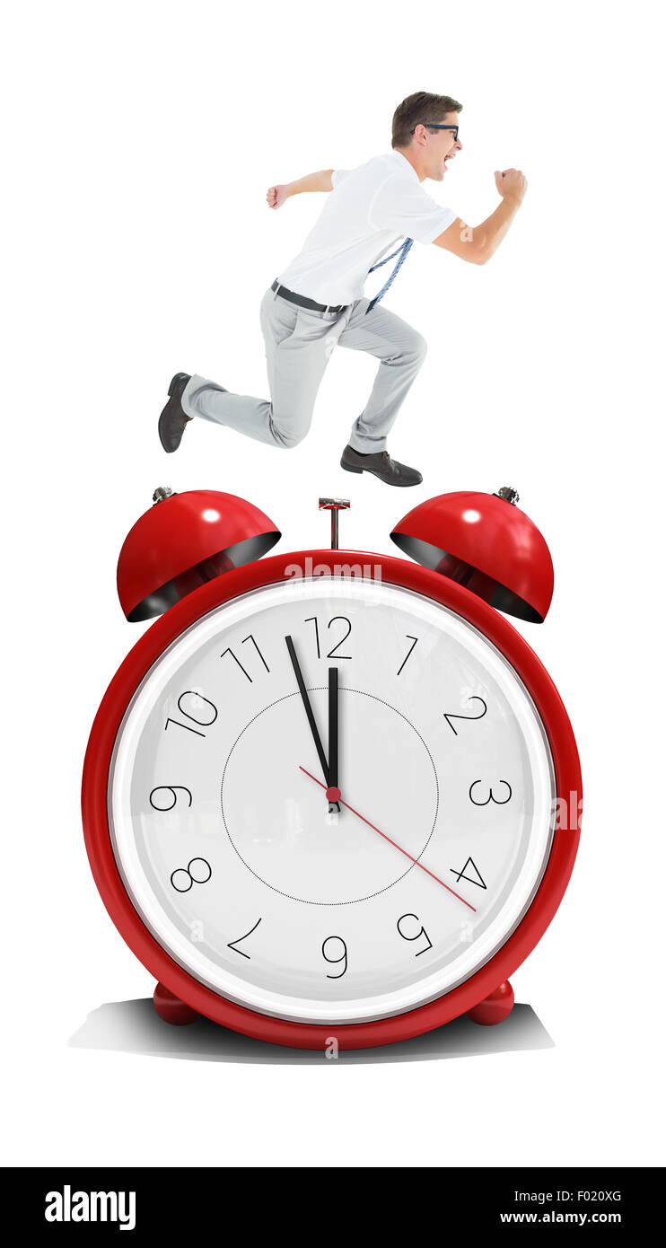 Composite image of geeky happy businessman running mid air Stock Photo ...