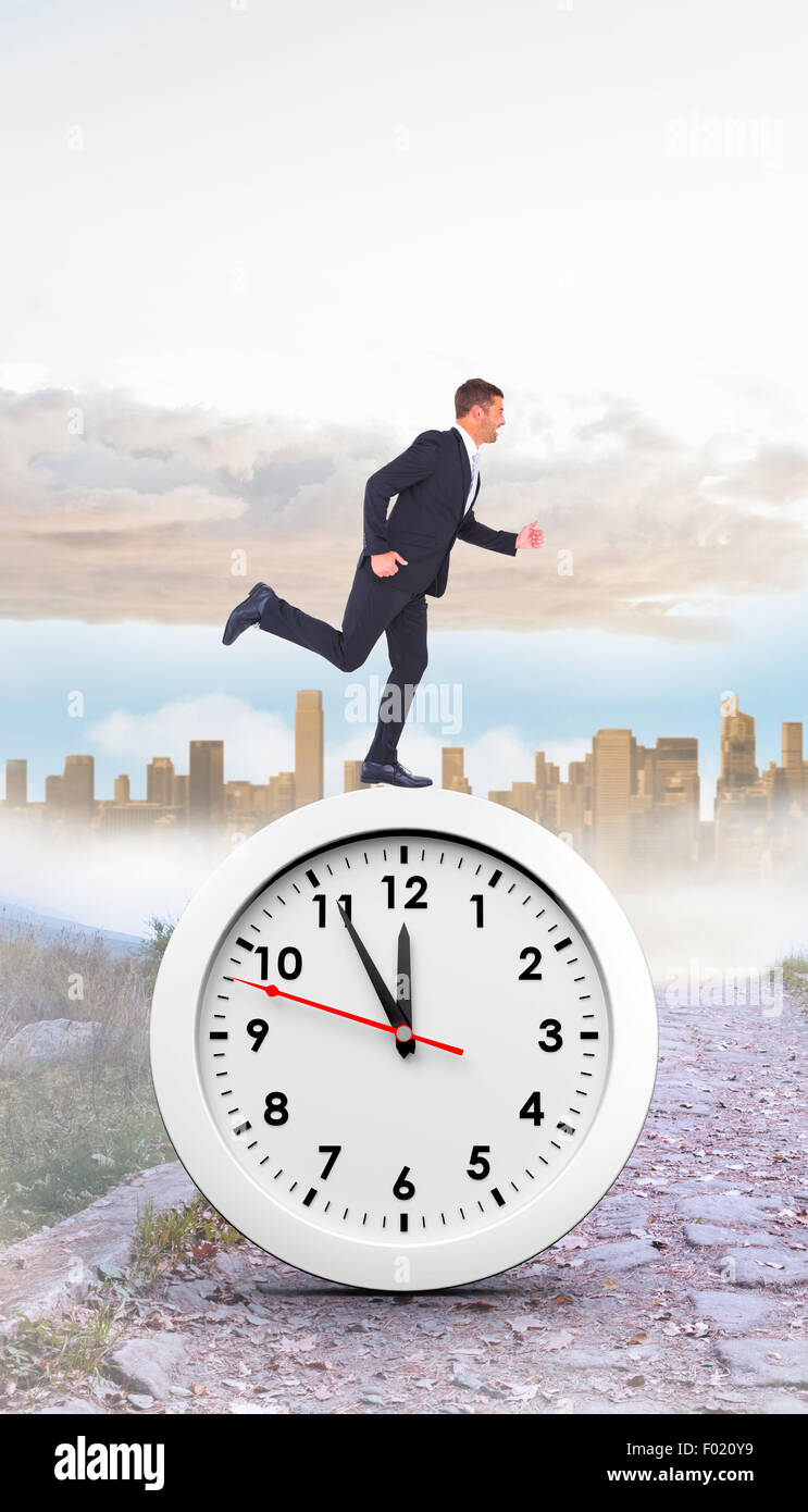 Composite image of businessman running Stock Photo - Alamy