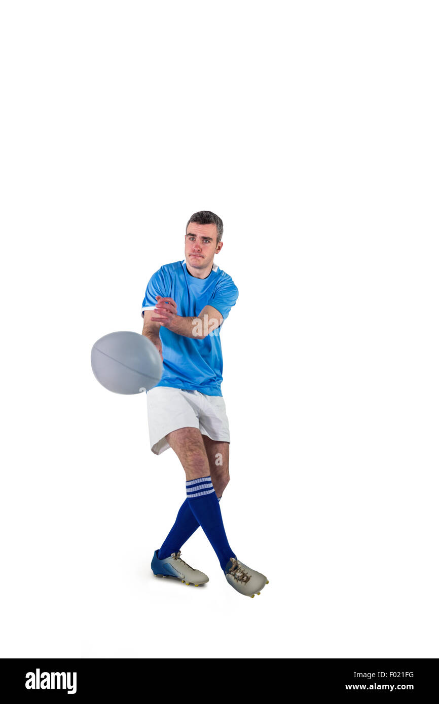 Rugby player throwing a rugby ball Stock Photo - Alamy