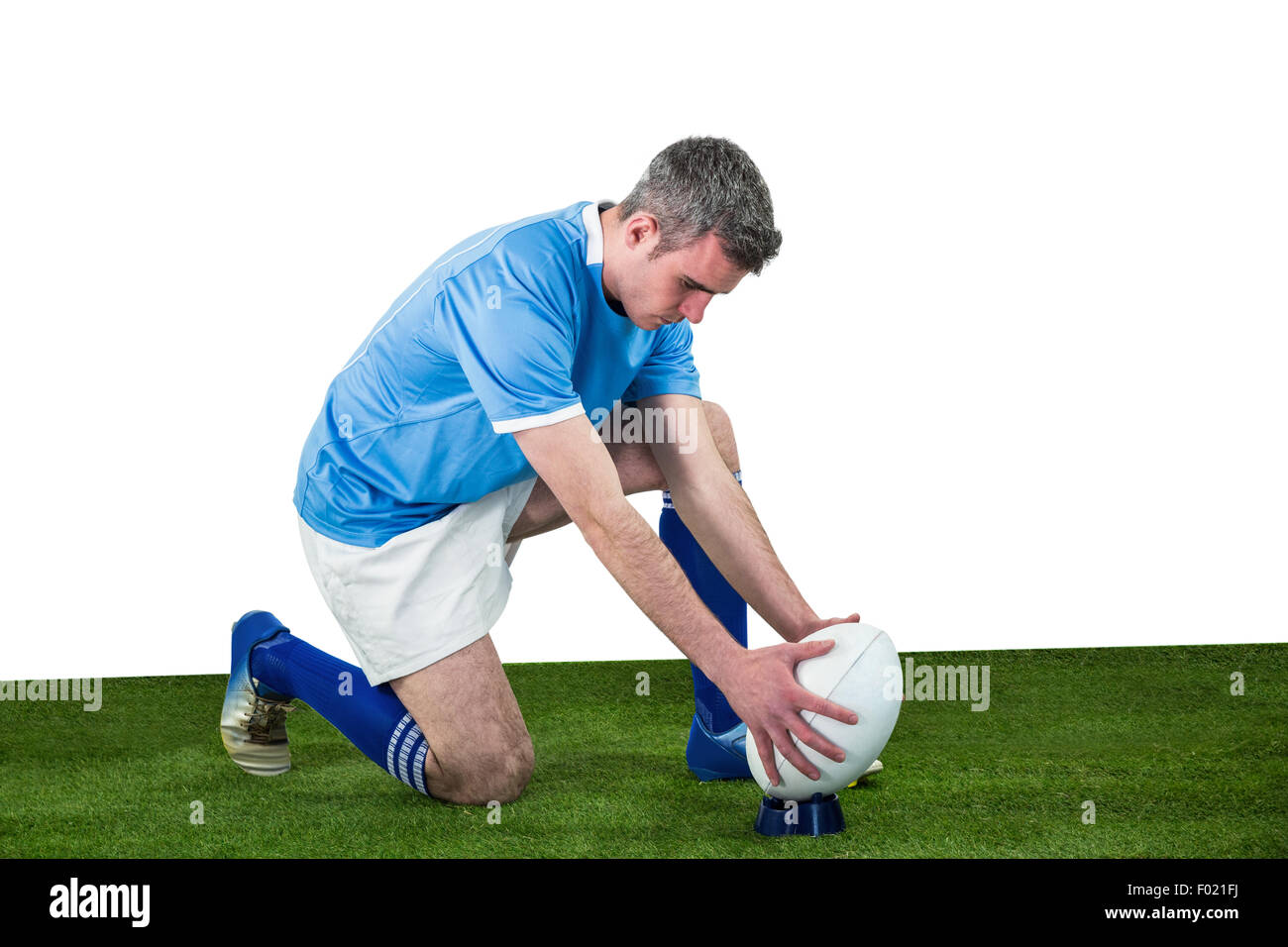 Rugby player ready to make a drop kick Stock Photo - Alamy