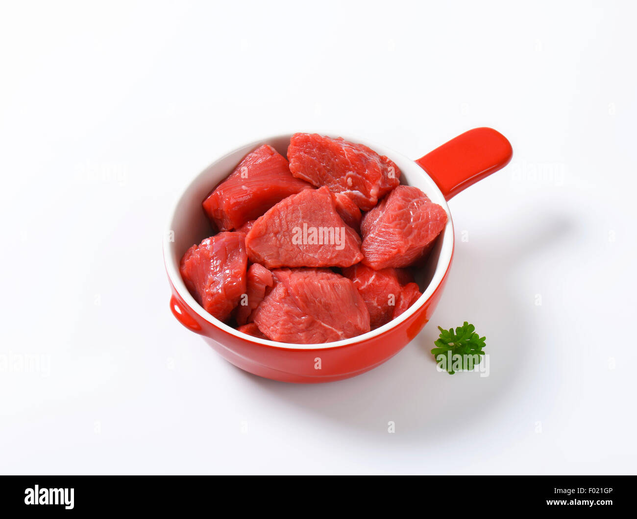 Raw diced beef in a pan Stock Photo - Alamy