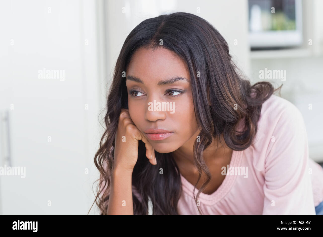 Sad woman thinking at the counter Stock Photo - Alamy