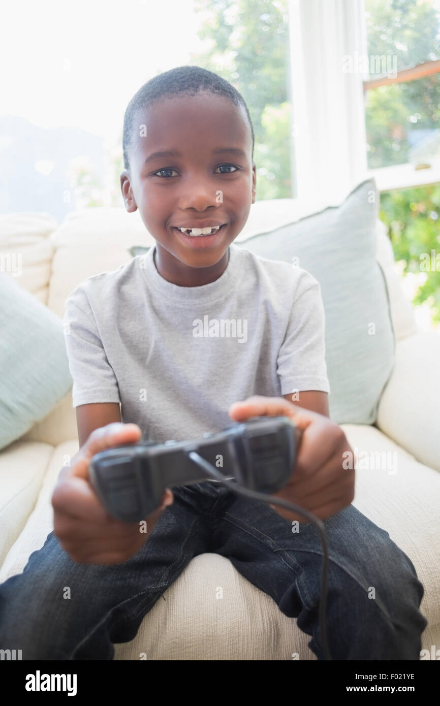 Little boy playing video games Stock Photo - Alamy