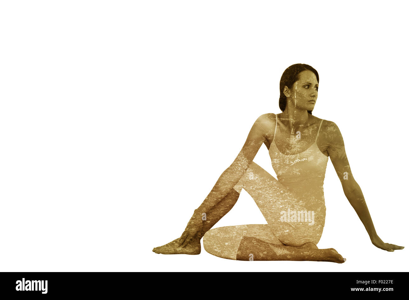 Composite image of fit woman doing the half spinal twist pose in ...