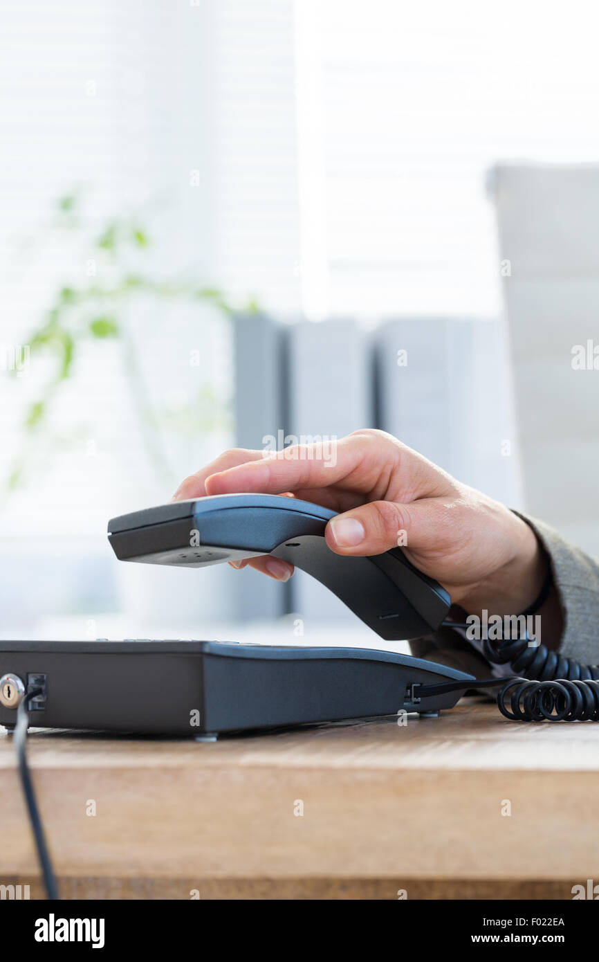 Businessman answer the phone Stock Photo - Alamy
