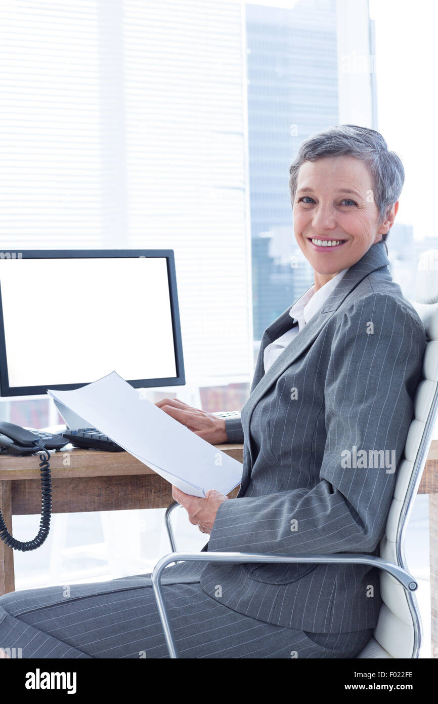 Smiling businesswoman using computer Stock Photo - Alamy