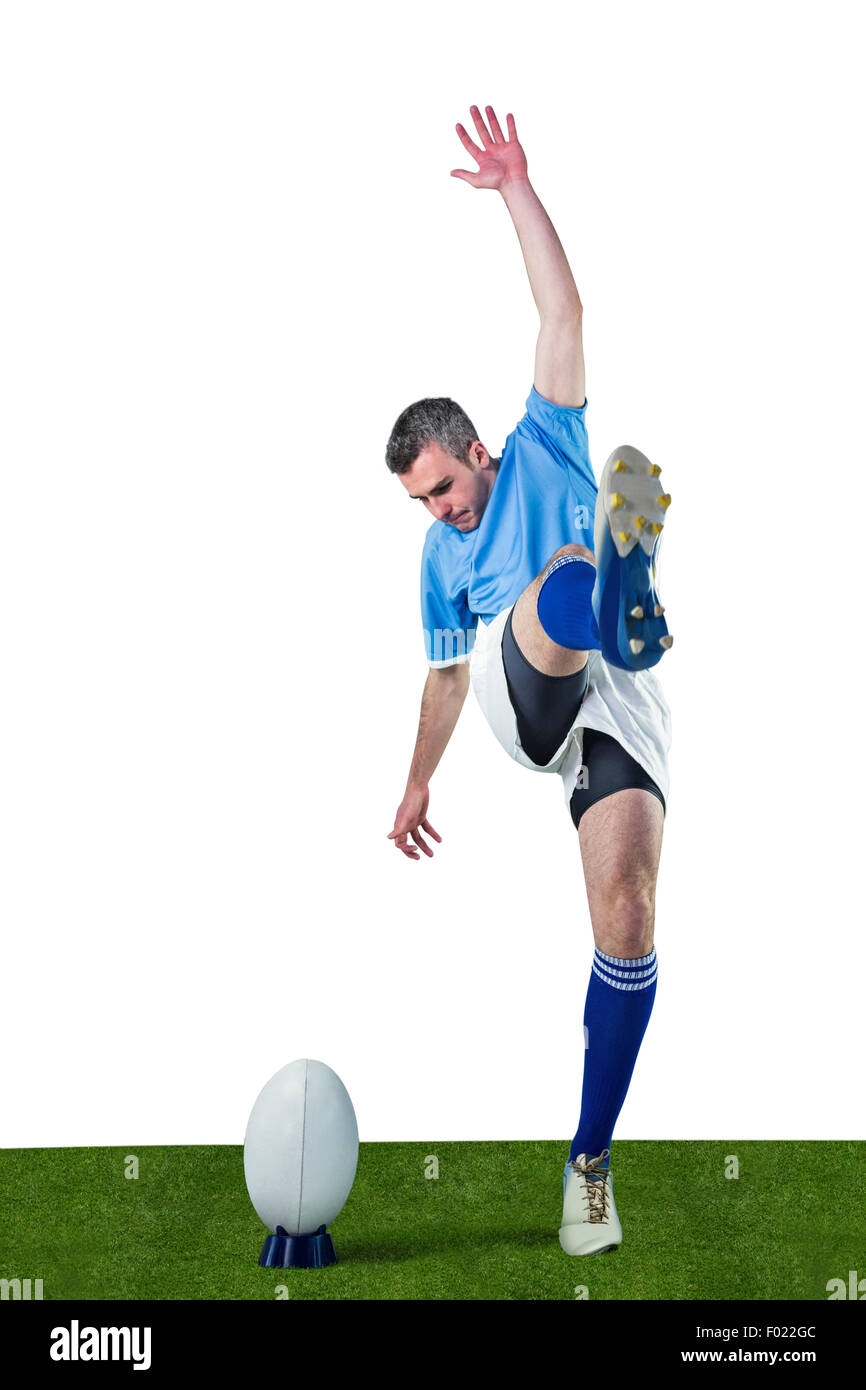 Rugby player doing a drop kick Stock Photo - Alamy