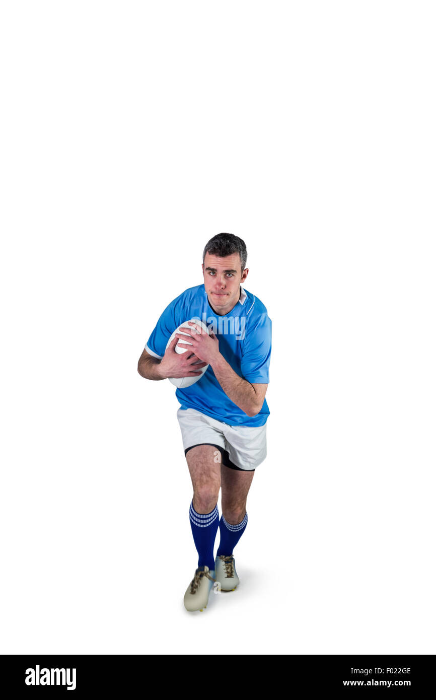 Rugby player running with the rugby ball Stock Photo - Alamy