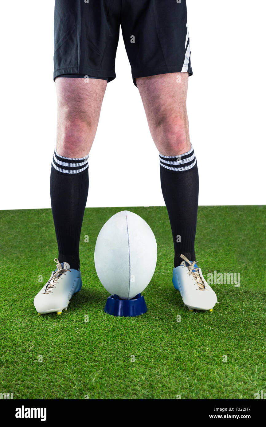 Rugby player ready to make a drop kick Stock Photo - Alamy